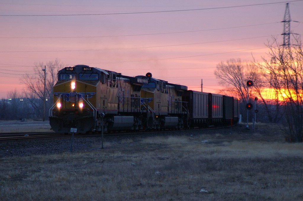 UP 6063 and UP 6048 are westbound with Mid-America Energy coal empties at sunrise